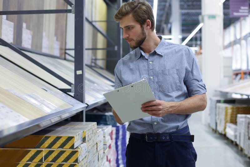 Manager Use His Tablet for Online Checking Products Available Stock ...