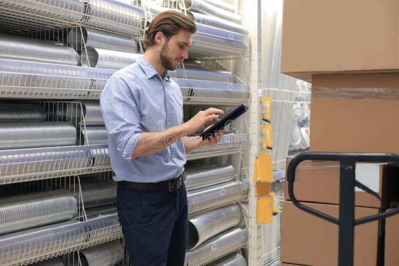 Manager Use His Tablet for Online Checking Products Available Stock ...