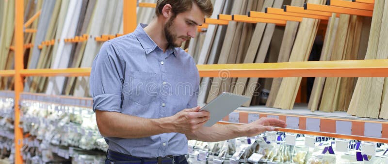 Manager Use His Tablet for Online Checking Products Available Stock ...