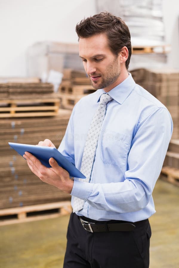 Manager Using Digital Tablet in Warehouse Stock Image - Image of ...