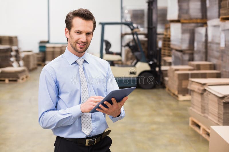 Manager Using Digital Tablet in Warehouse Stock Image - Image of happy ...