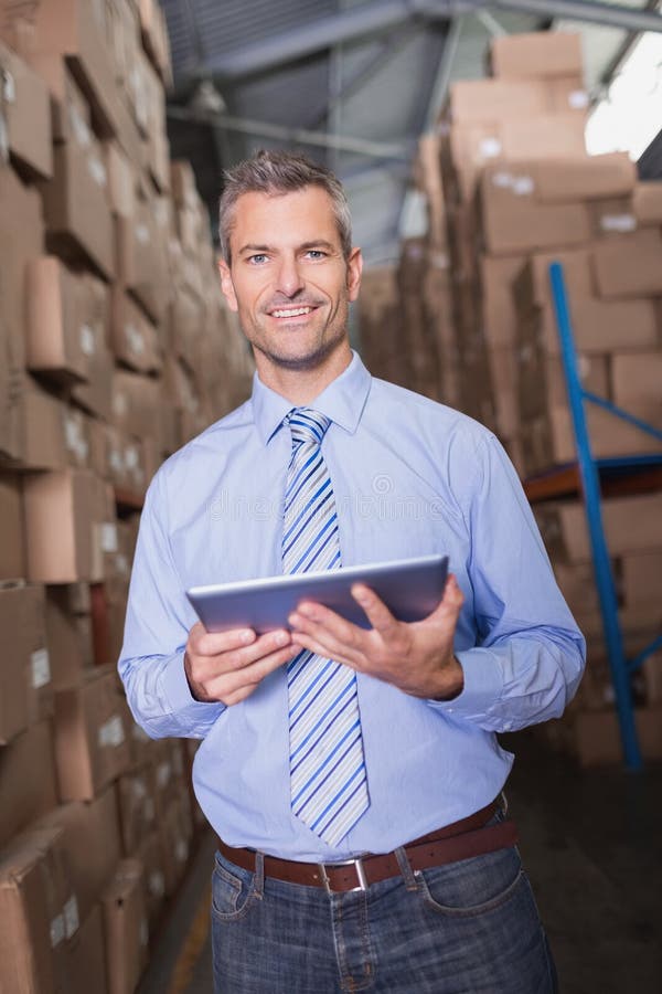 Manager Using Digital Tablet in Warehouse Stock Image - Image of ...