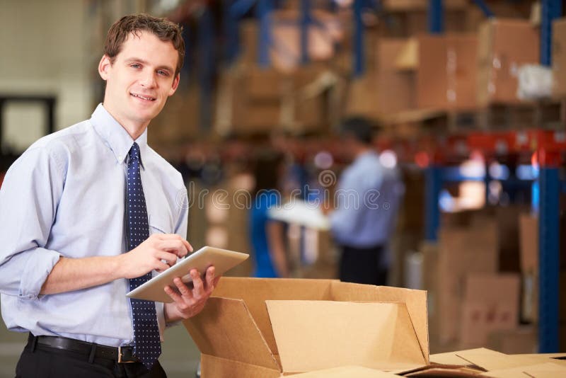Man Carrying Boxes in Warehouse Stock Photo - Image of business ...