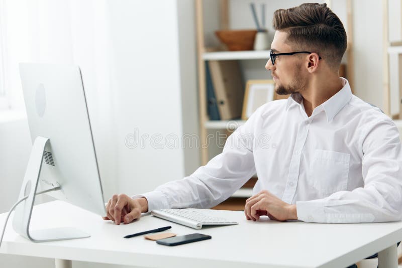 Manager in a White Shirt Sits at a Computer Work Documentation Office ...
