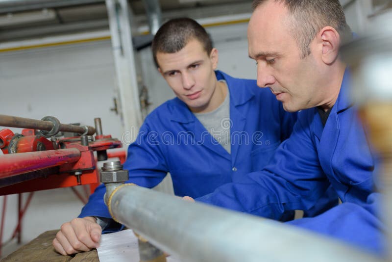 Manager and Worker in Factory Storeroom Stock Photo - Image of industry ...