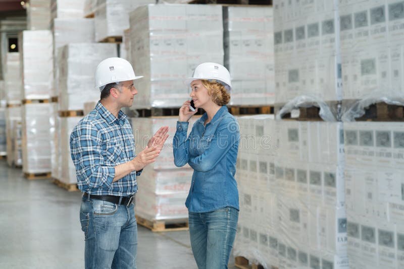 Manager and Worker Holding Clipboard in Warehouse Stock Image - Image ...