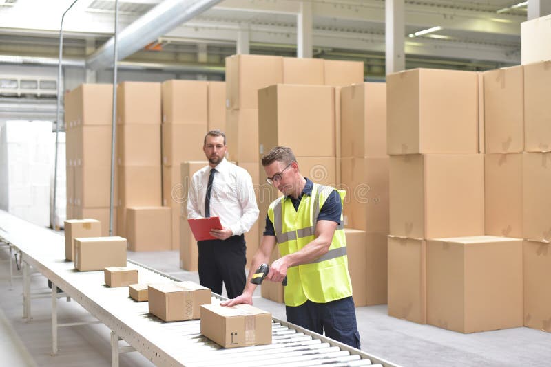 Manager and Worker in a Warehouse in the Logistics Sector - Transport ...