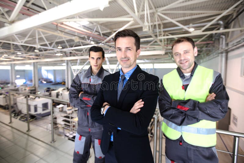Workers in CNC factory stock photo. Image of plant, engineering - 77498520