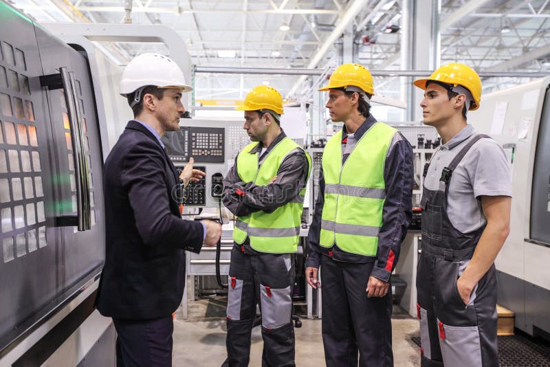 Manager and Workers Near CNC Machines Stock Image - Image of metalwork ...
