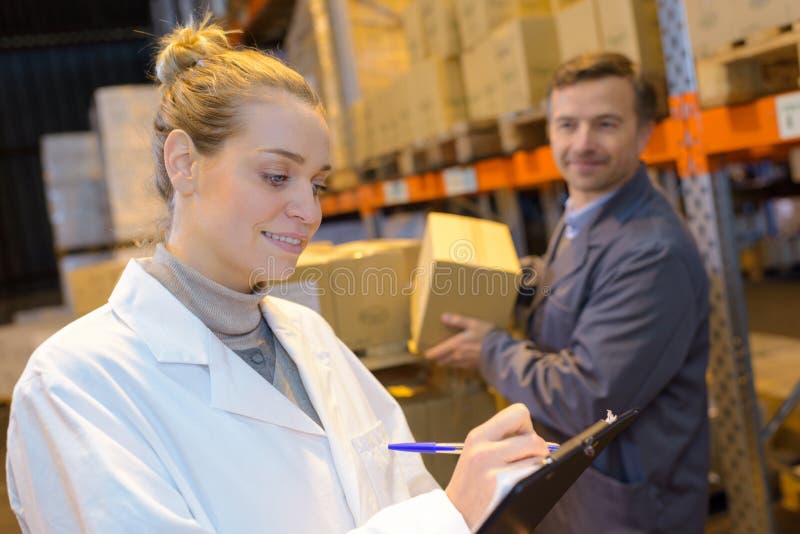 Manager Working with Colleague in Warehouse Stock Image - Image of male ...
