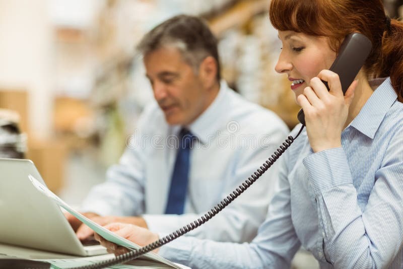 Manager Working on Laptop and Talking on Phone at Desk Stock Image ...