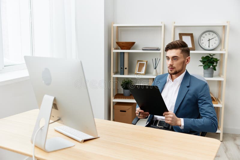 Manager Writes in Documents at the Desk in the Office Executive Stock ...