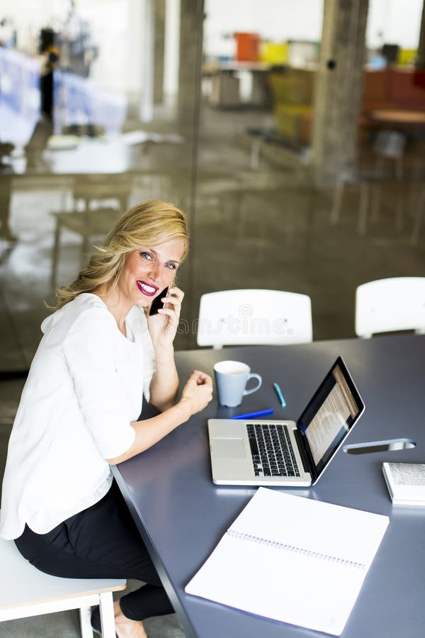 Manageress with Mobile Phone in Office Stock Photo - Image of boss ...