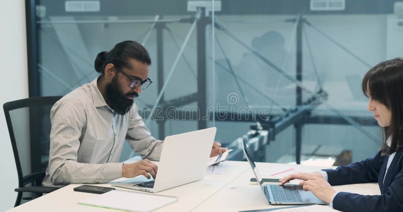 Managerial Pair Engaged with Papers in Office Setting Stock Video ...