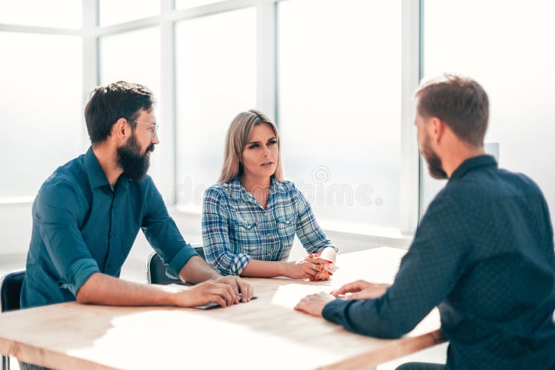 Managers and Job Seeker Sitting at the Table during the Interview Stock ...