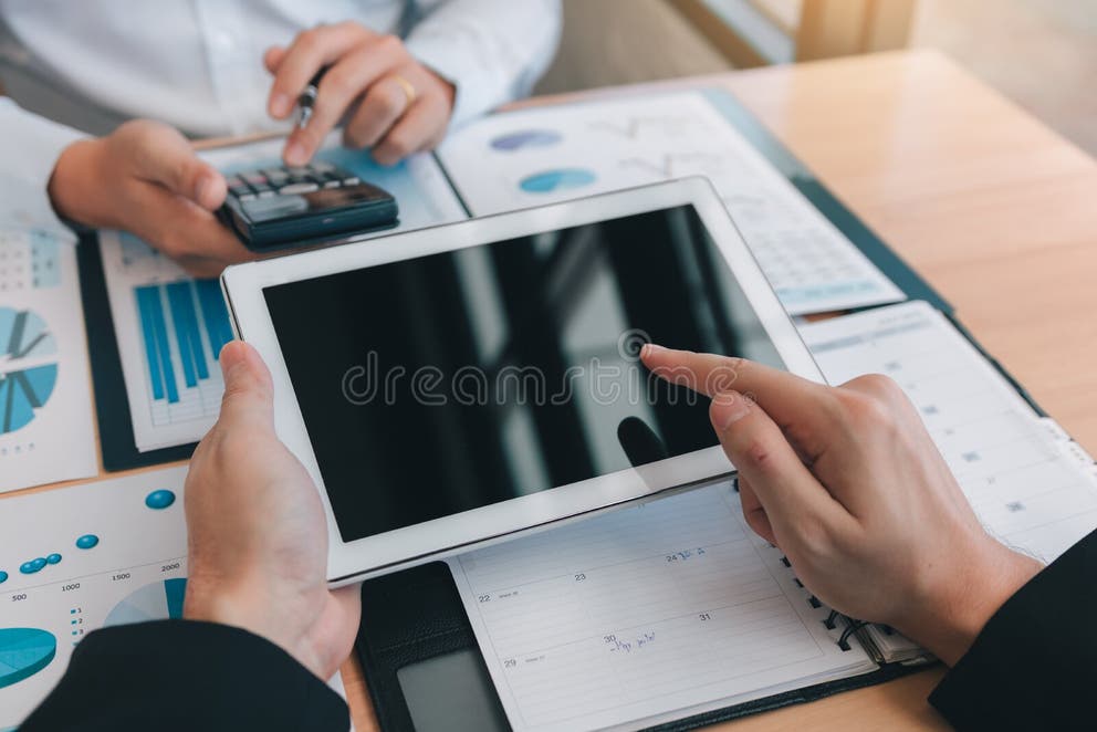 Managers are Using Tablets To Analyze Sales Cost Reports and Explain ...