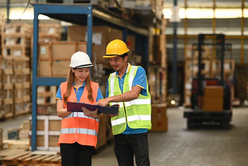 Managers and Warehouse Worker Checking Inventory in a Warehouse with ... Managers and Warehouse Worker Checking Inventory in a Warehouse with ...