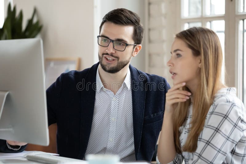 Managers Working at Computer Together and Discussing Ideas Stock Photo ...