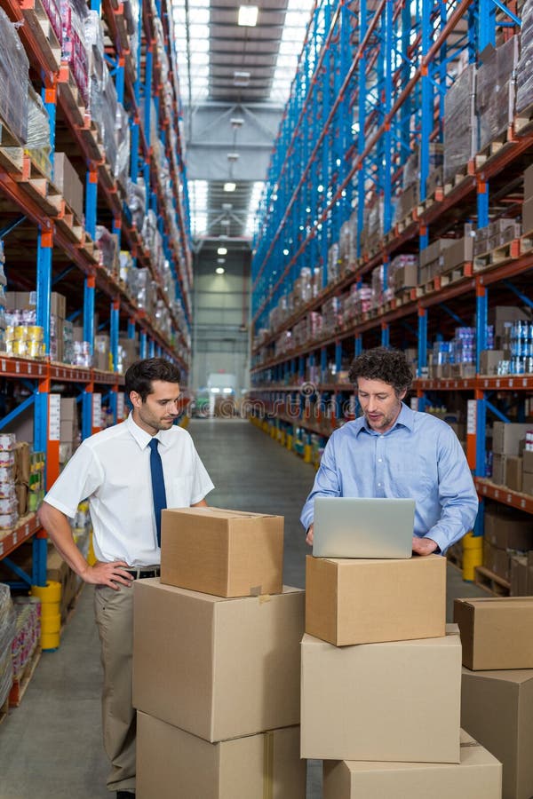Managers Working with a Laptop Put on a Cardboard Box Stock Image ...