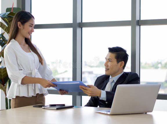 Managing Director in Suit Returns Document Folder To Secretary with an ...