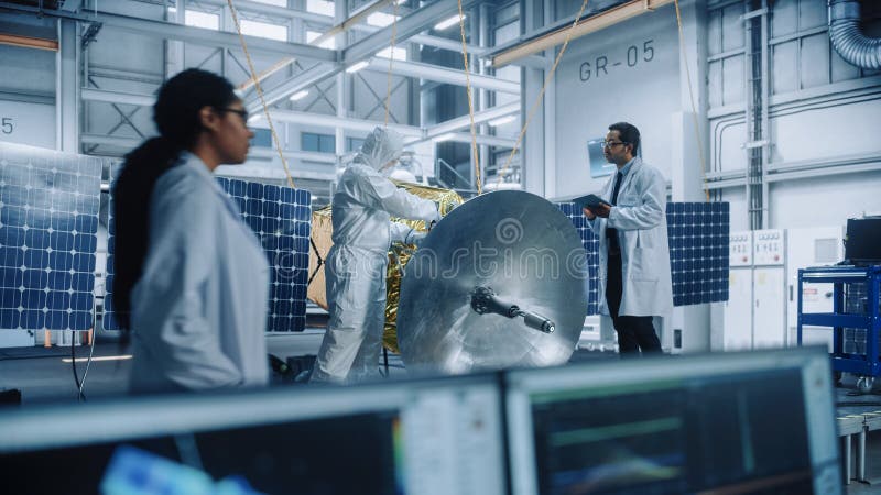 Managing Engineer and Chief Technician Working on Satellite ...