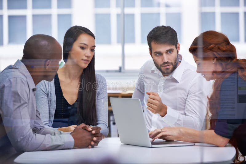 Managing Things As a Team. a Group of Businesspeople Having a Meeting ...