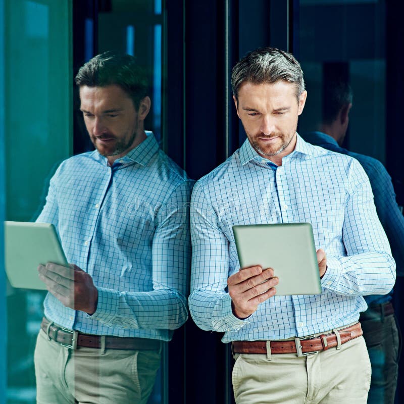 Managing Work Tasks with Modern Technology. a Businessman Using a ...