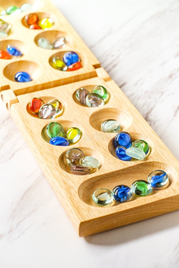 Mancala Board Game stock image. Image of games, table - 145585097