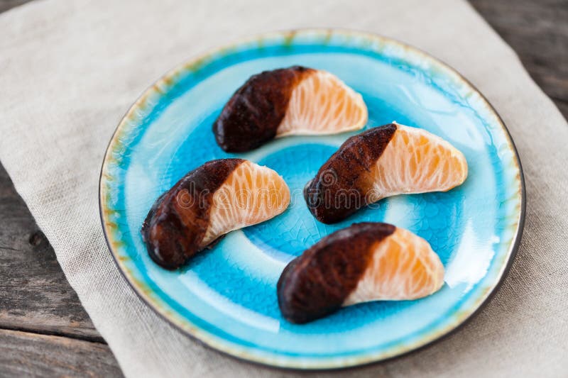 Mandarin with chocolate stock image. Image of molten - 65128687