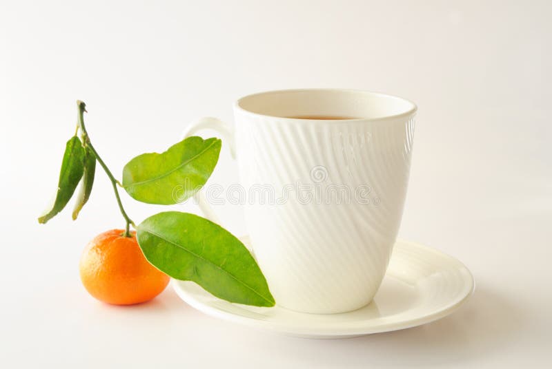 Mandarin with cup of tea stock photo. Image of fruit - 29374694