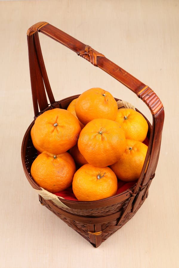 Mandarin Oranges in Basket with Chinese New Year Red Packets and Lion ...
