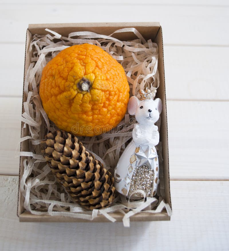 Mandarin and Pine Cone in a Packing Box Stock Photo - Image of ripe ...