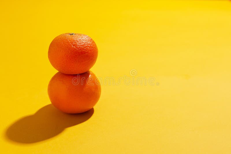 Mandarins with Leaves in Stack on Orange Background Stock Image - Image ...