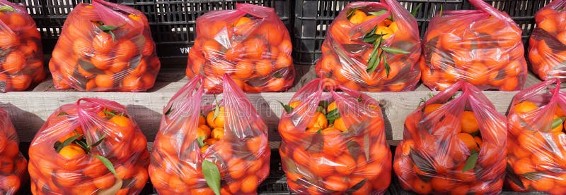Mandarins in Plastic Bag Displayed for Sale on the Street Stock Photo ...