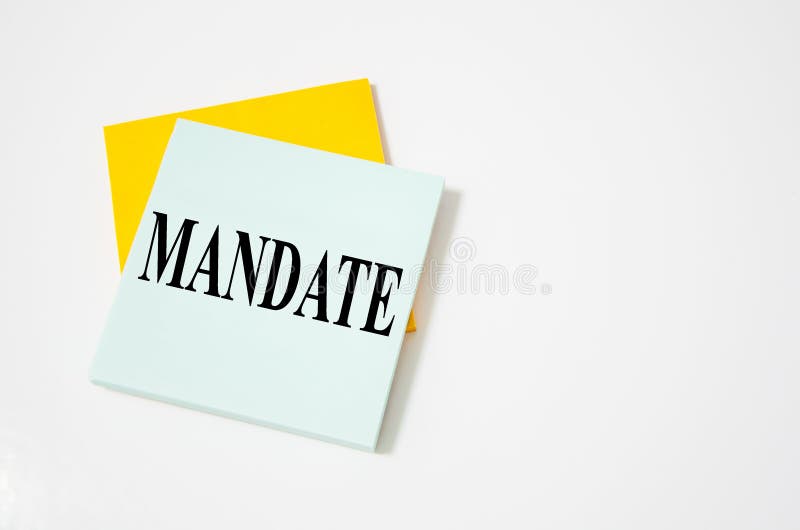 Mandate Text Written on a White Notepad with Colored Pencils and a ...