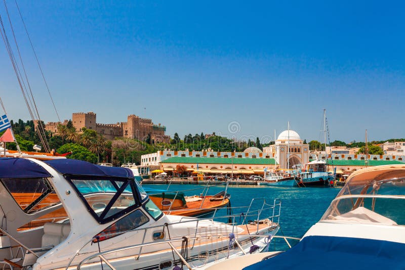 Mandraki Harbor in Rhodes. editorial image. Image of attraction - 64333585