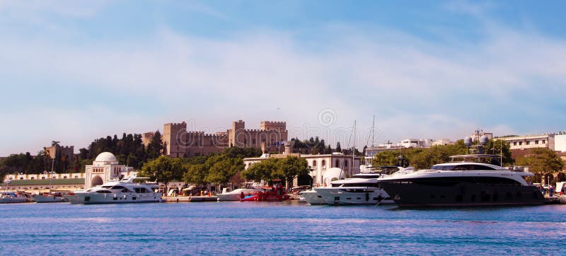 MANDRAKI HARBOUR, RHODES, GREECE - MARCH 18, 2020: Mandraki Harbour and ...
