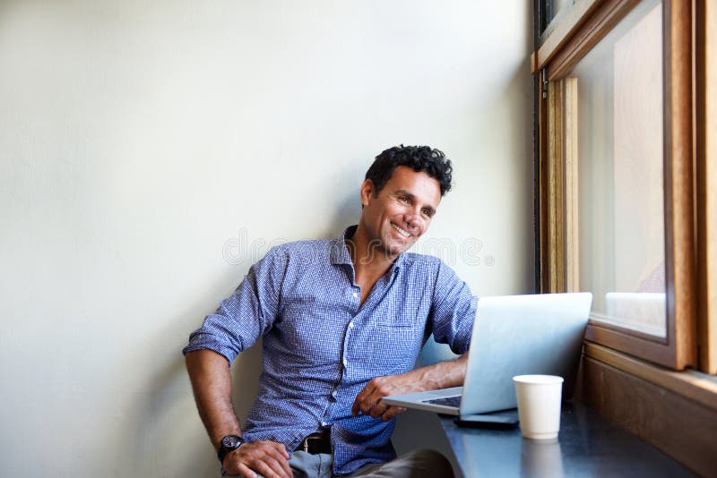 Mandsome Modern Man Smiling with Laptop at Cafe Stock Image - Image of ...