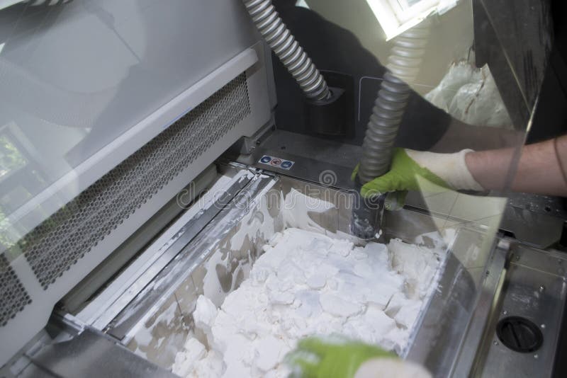 Worker Taking Out Models of White Polyamide Powder and Cleaning Them ...