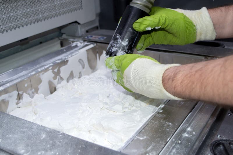 Worker Taking Out Models of White Polyamide Powder and Cleaning Them ...