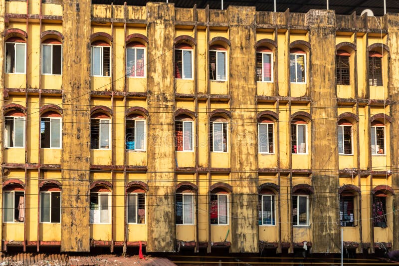Exterior Facade of an Old Grungy Building with Many Arched Windows ... Exterior Facade of an Old Grungy Building with Many Arched Windows ...