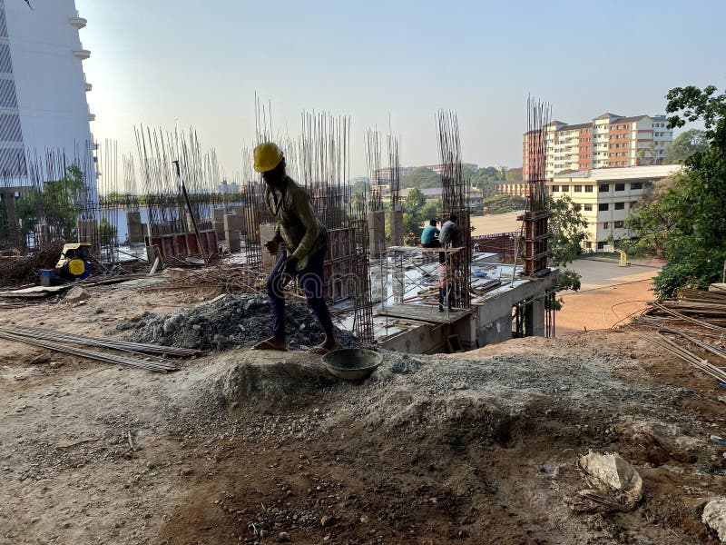 A Labourer Working at a Building Construction Site in the City ...