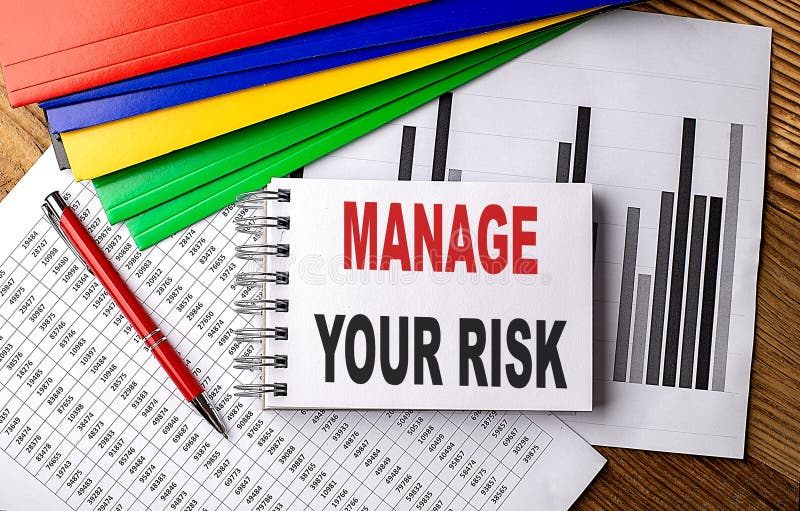 MANGE YOUR RISK Text on Notebook with Folder on Chart Stock Photo ...