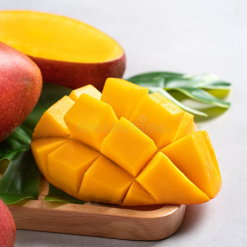 Mango Background Design Concept. Diced Fresh Mango Fruit on White Table ...