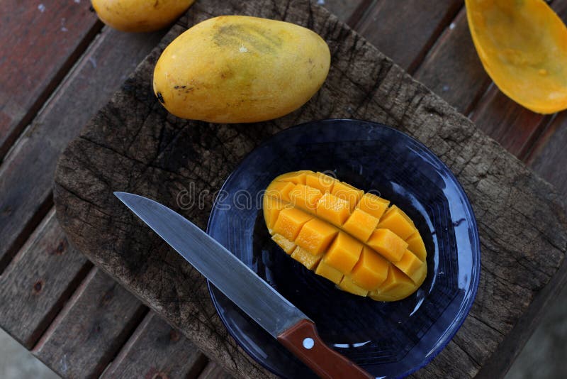 Mango on chopping board stock image. Image of color, outdoor - 47108945