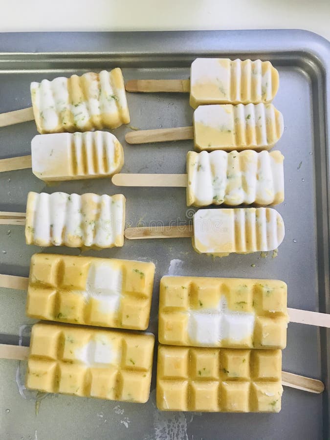 Mango and Coconut Popsicles on a Stick Stock Photo - Image of dessert ...