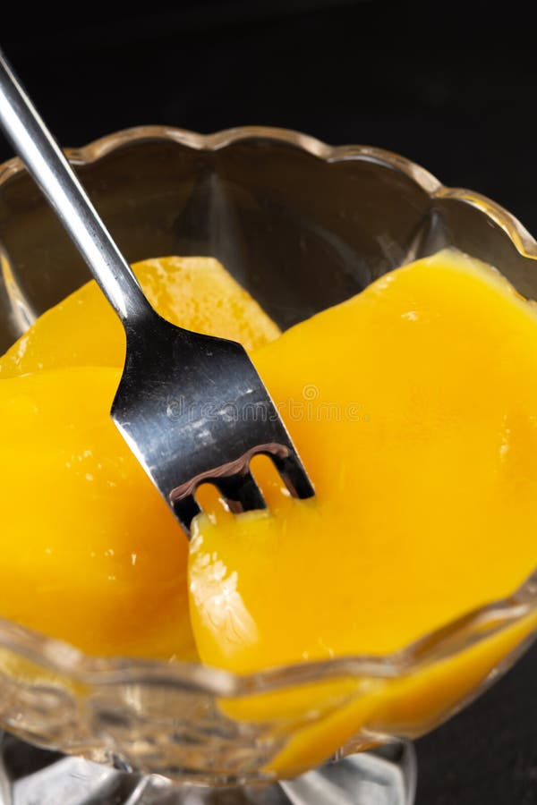 Mango Compote Closeup with Fork in the Mango Stock Photo - Image of ...