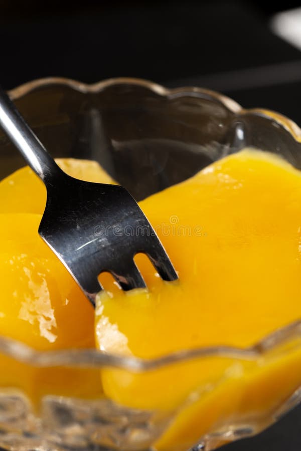 Mango Compote Closeup with Fork in the Mango Stock Photo - Image of ...