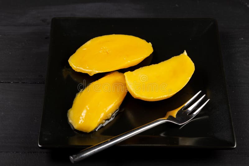 Mango Compote Served on the Plate with Fork Stock Photo - Image of ...