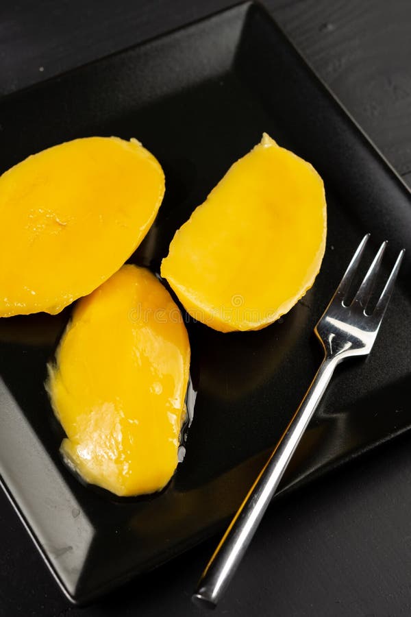 Mango Compote Served on the Plate with Fork Stock Photo - Image of ...